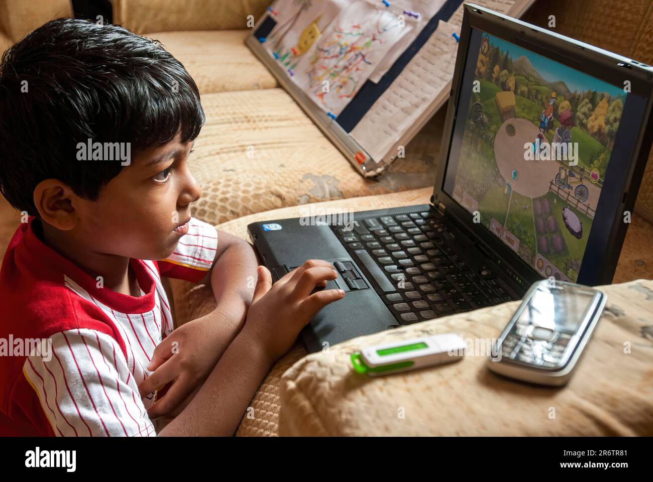 Four-year-old Indian boy child playing game in computer, Karnataka ...