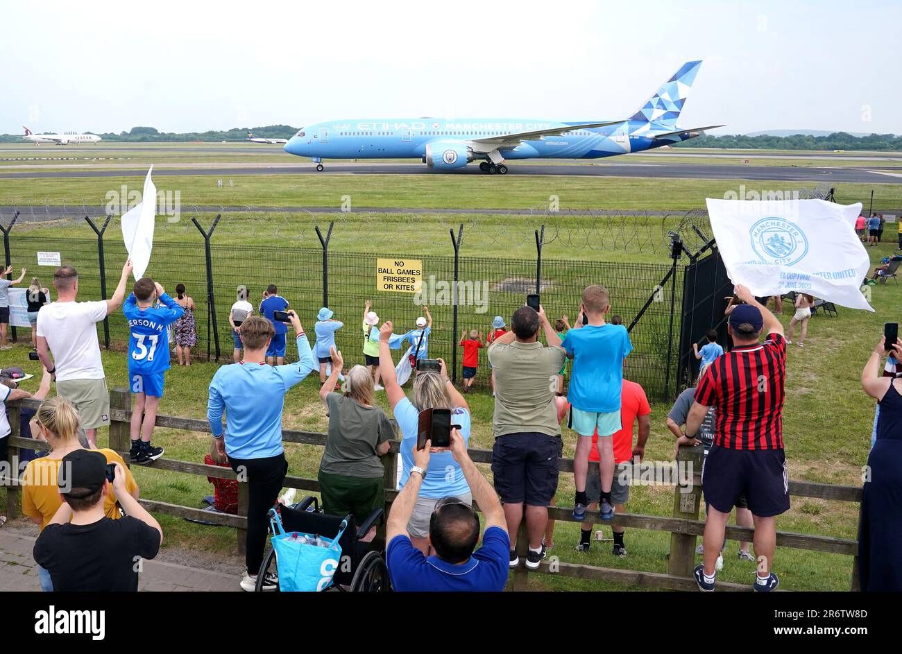Manchester City fans watch on as the Boeing 787-9 Dreamliner carrying ...