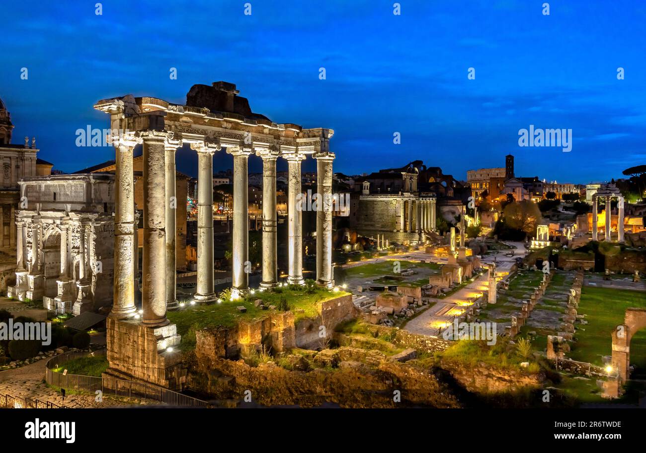The Roman Forum illuminated at night with the ruins of The Temple Of ...