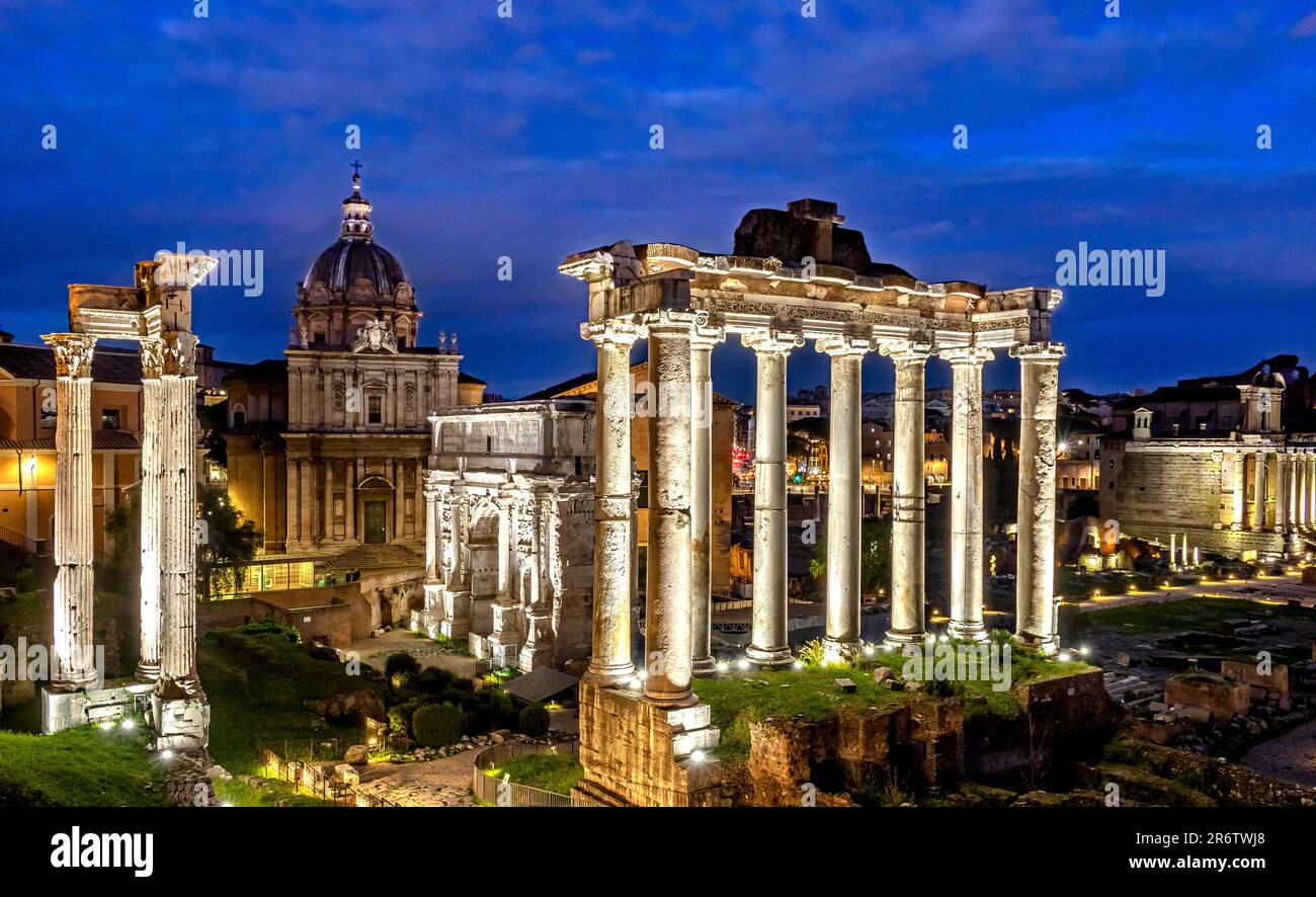 The Roman Forum illuminated at night with the ruins of The Temple Of ...