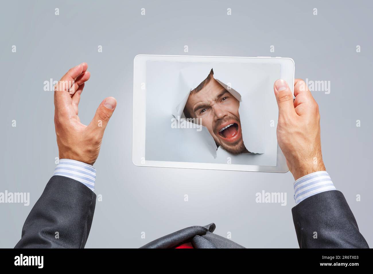 Male face through the hole in paper Stock Photo - Alamy