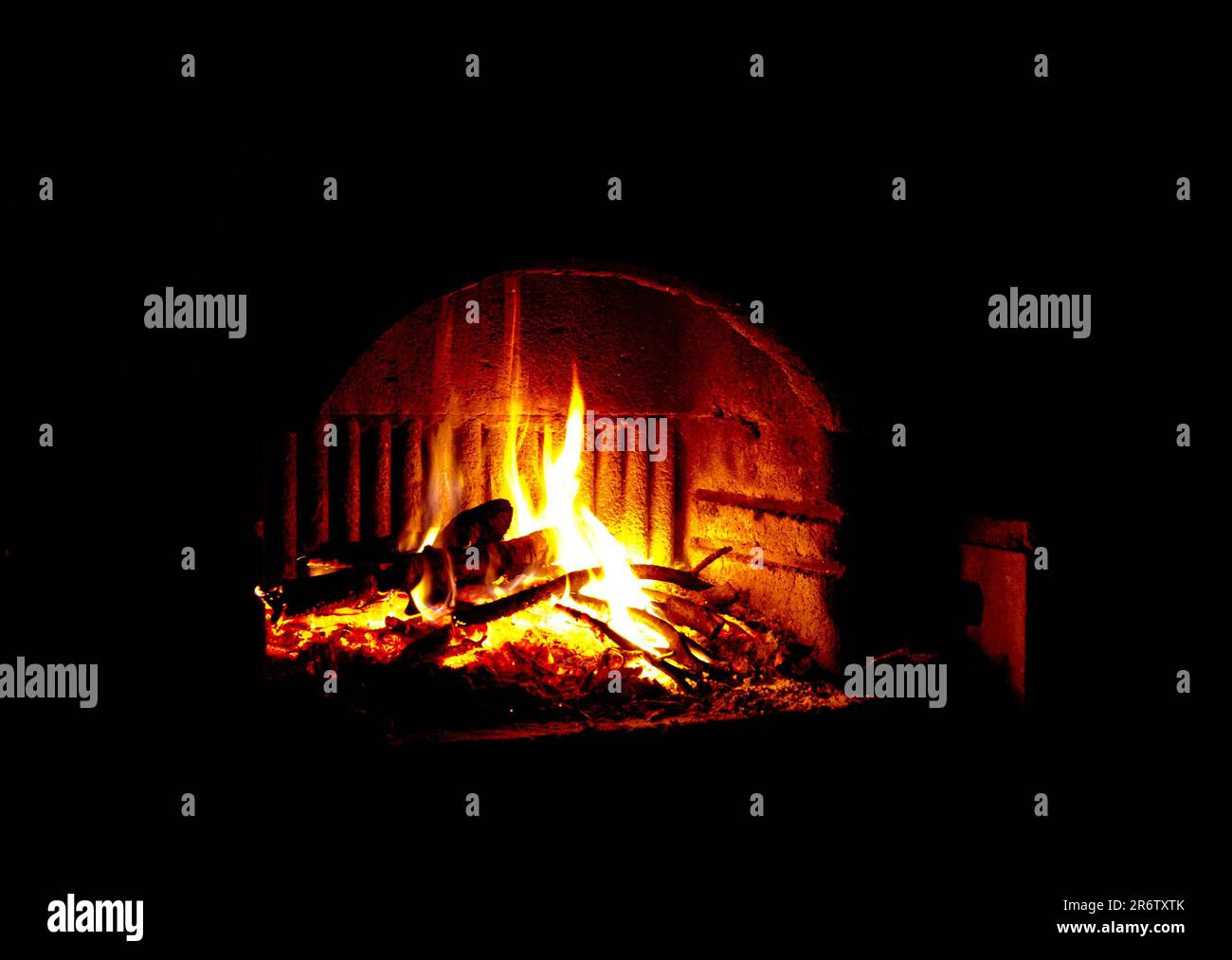 Shining dry burning wood in the stone fireplace Stock Photo - Alamy