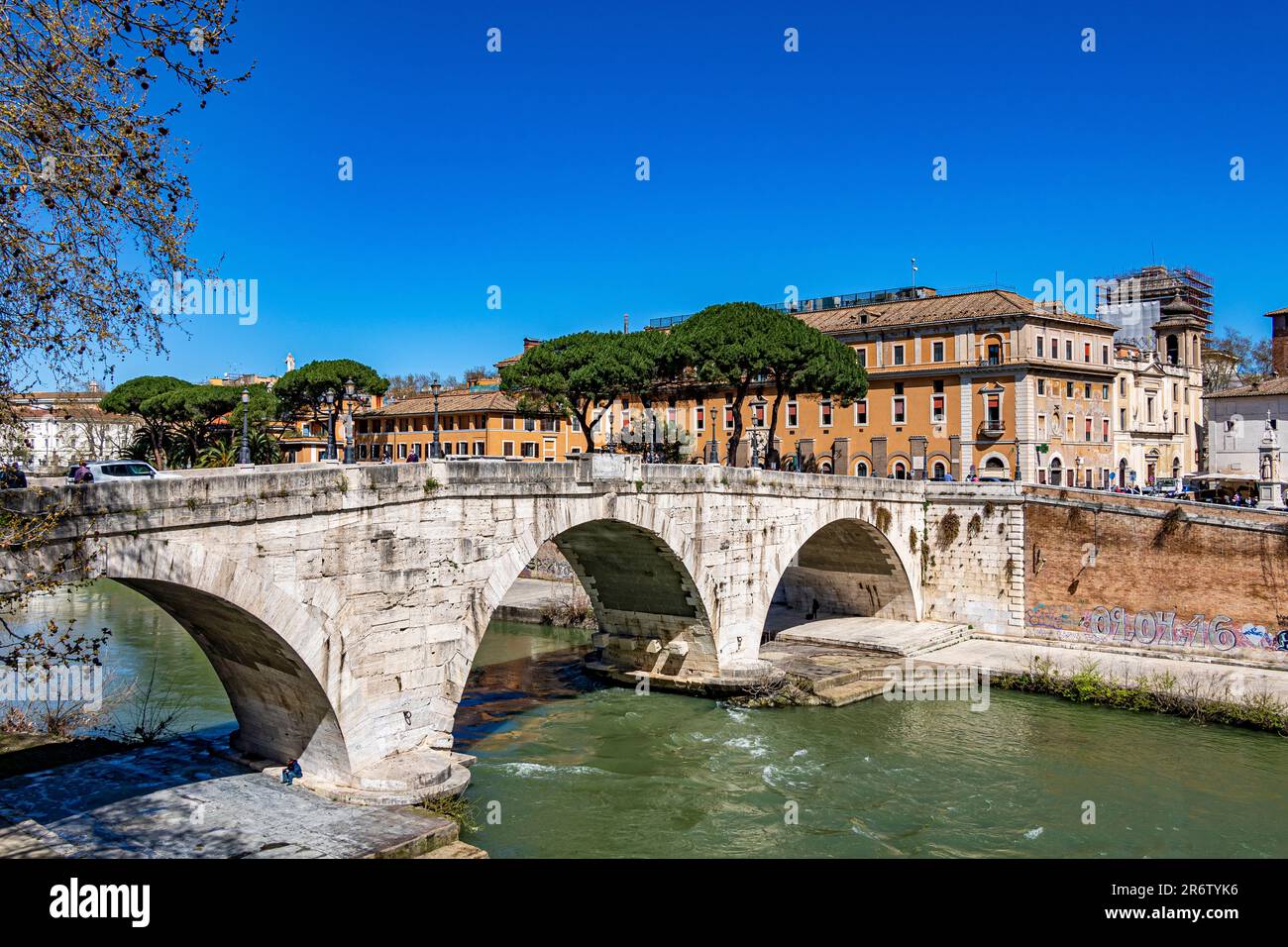 The Ponte Cestio bridge spanning The River Tiber with Tiber Island in ...