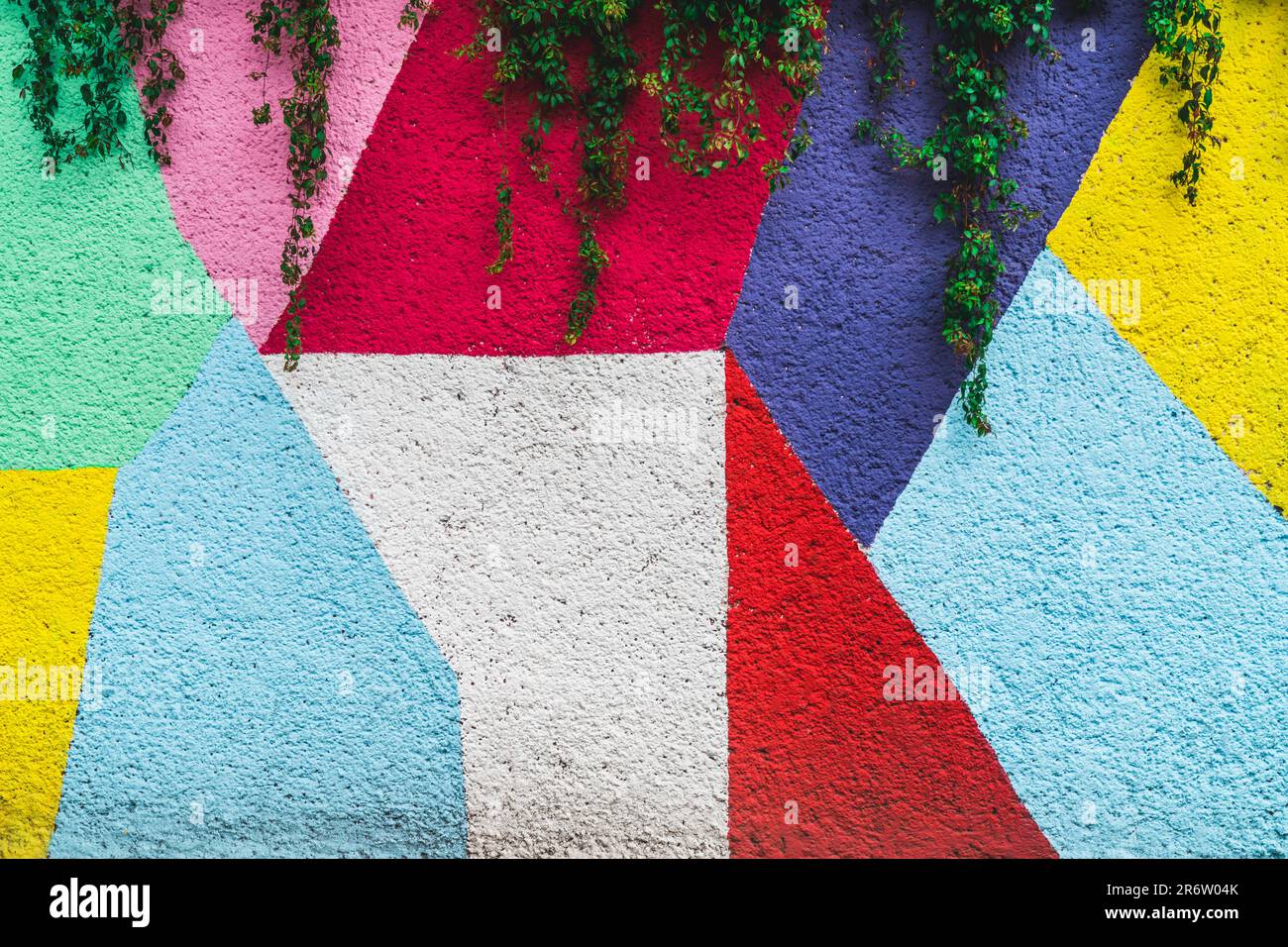 A mesmerizing abstract background adorns the wall, vibrant geometric ...