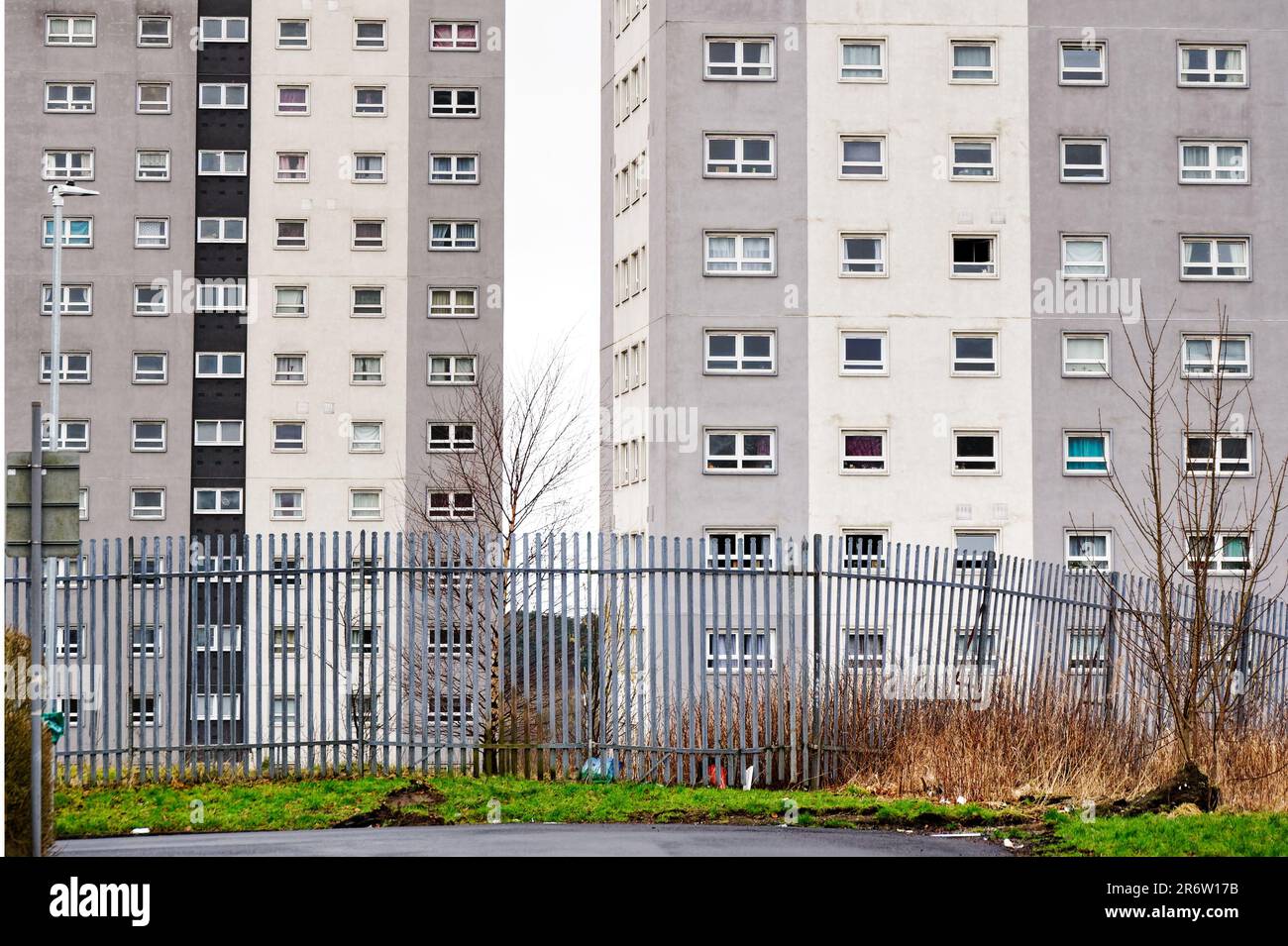 High rise council flats in poor housing estate and empty play area ...