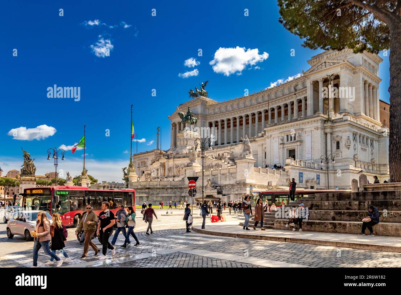 People crossing the road at Piazza Venezia in front of The Victor ...