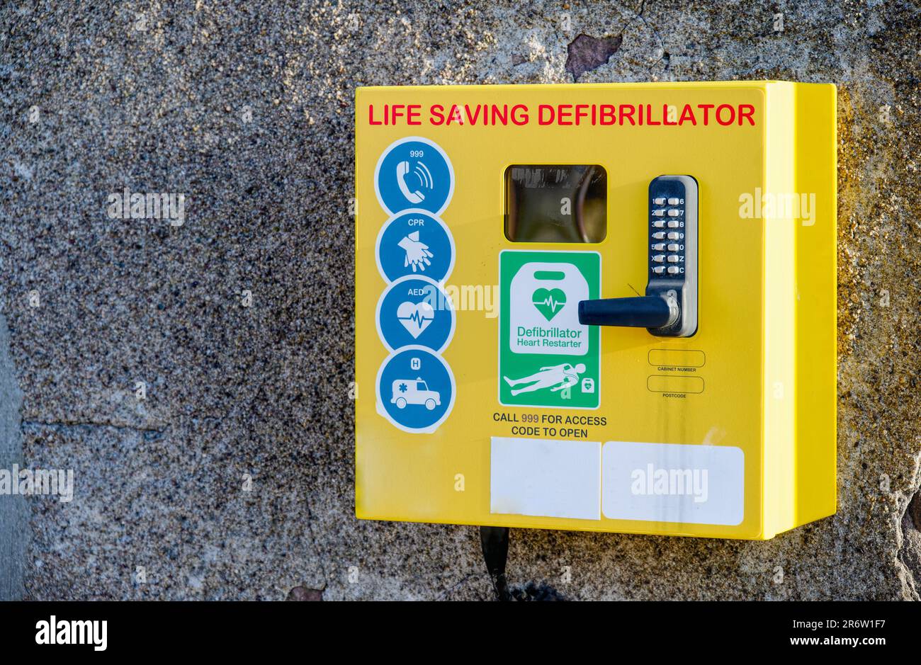 Defibrillator AED on wall in public space for emergency heart ...