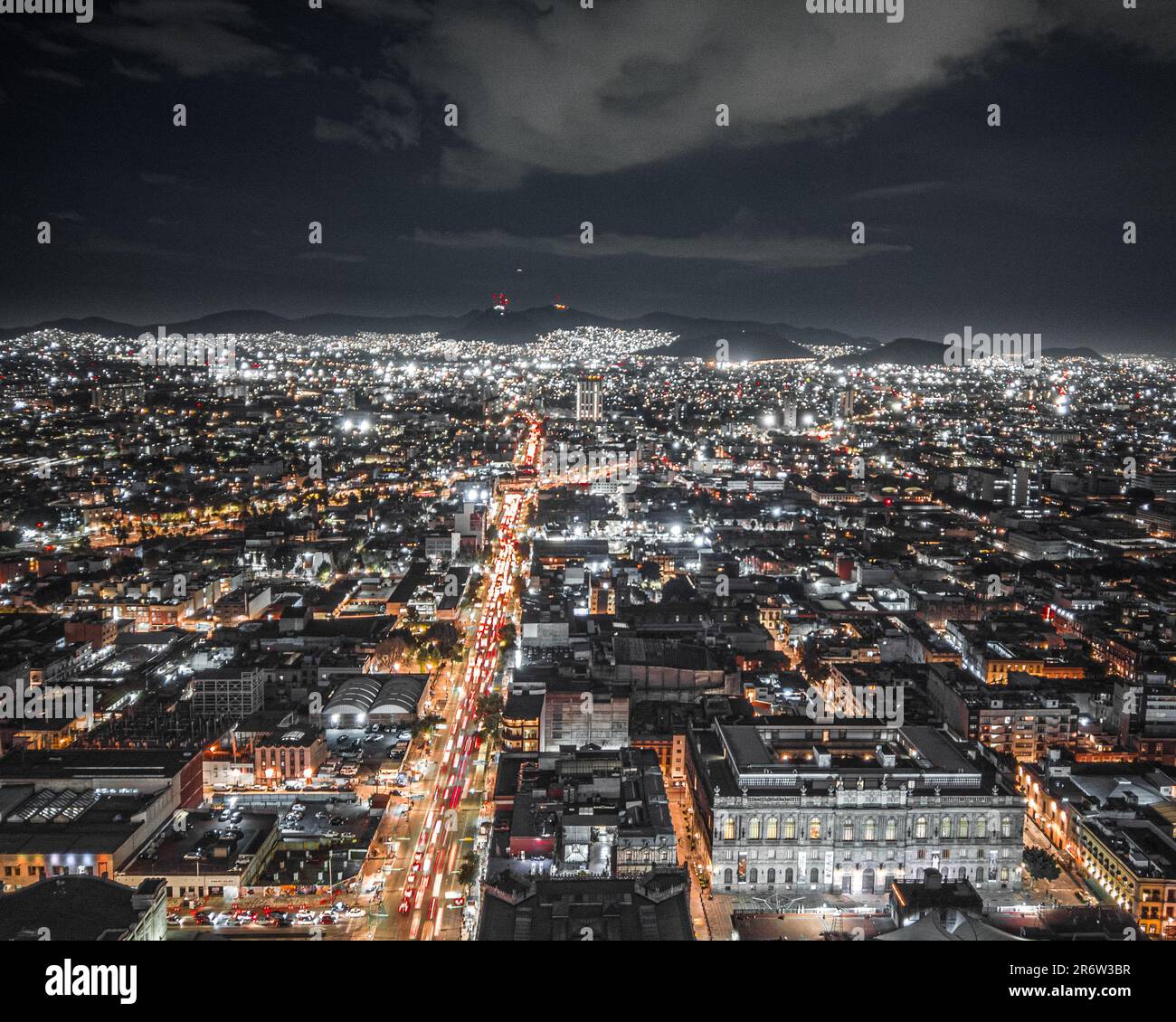 Aerial night view of Mexico City: The sprawling metropolis glows with a ...