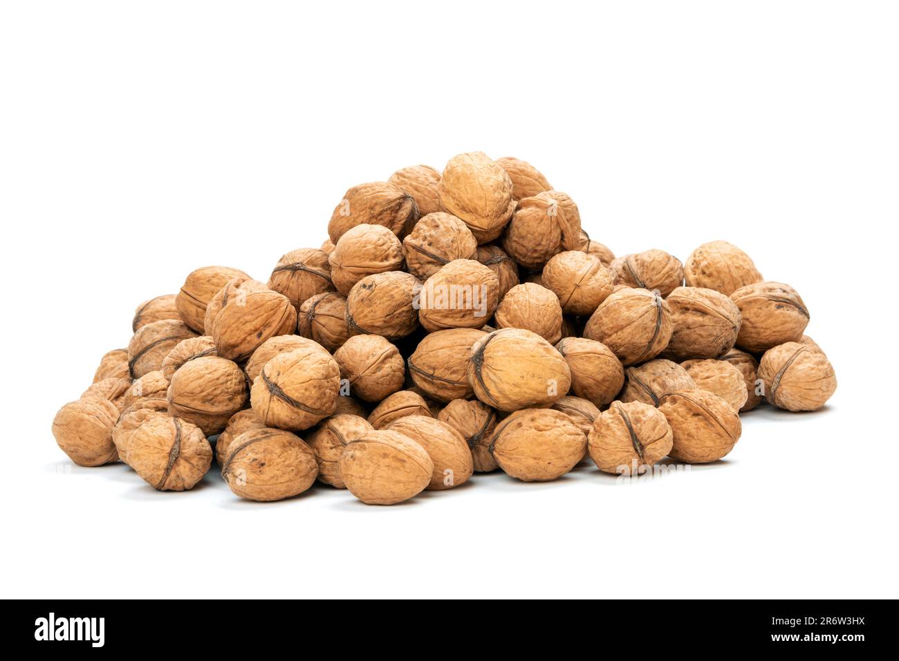 Heap of unpeeled nuts over white background Stock Photo - Alamy