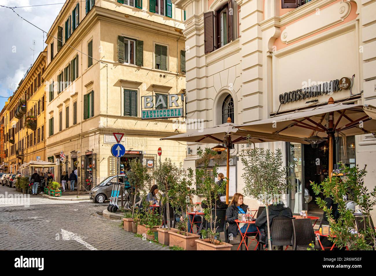 People sitting outside The Colosseum Bar in Monti ,a fashionable ...