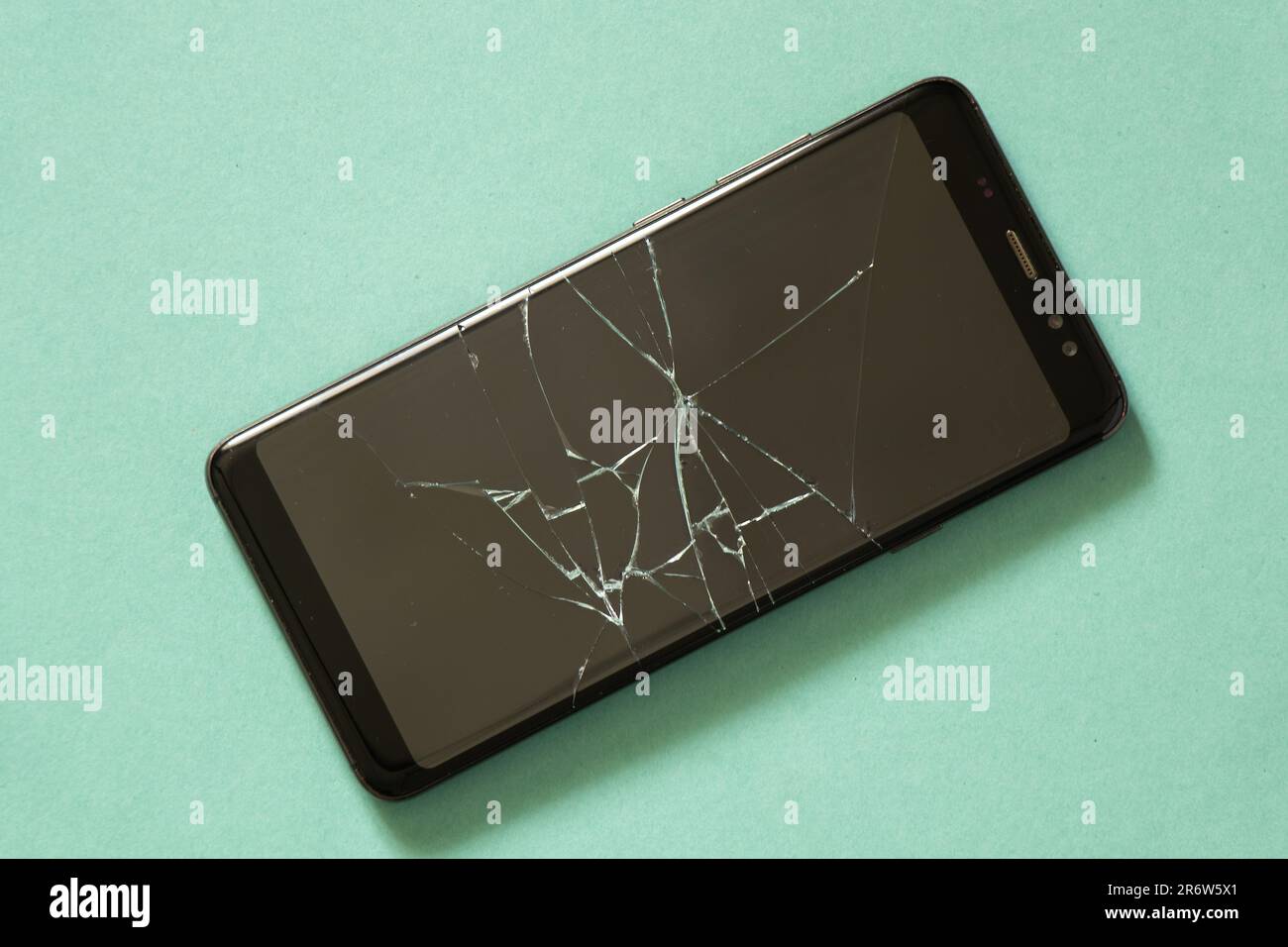 black phone with cracked screen on an isolated background Stock Photo ...