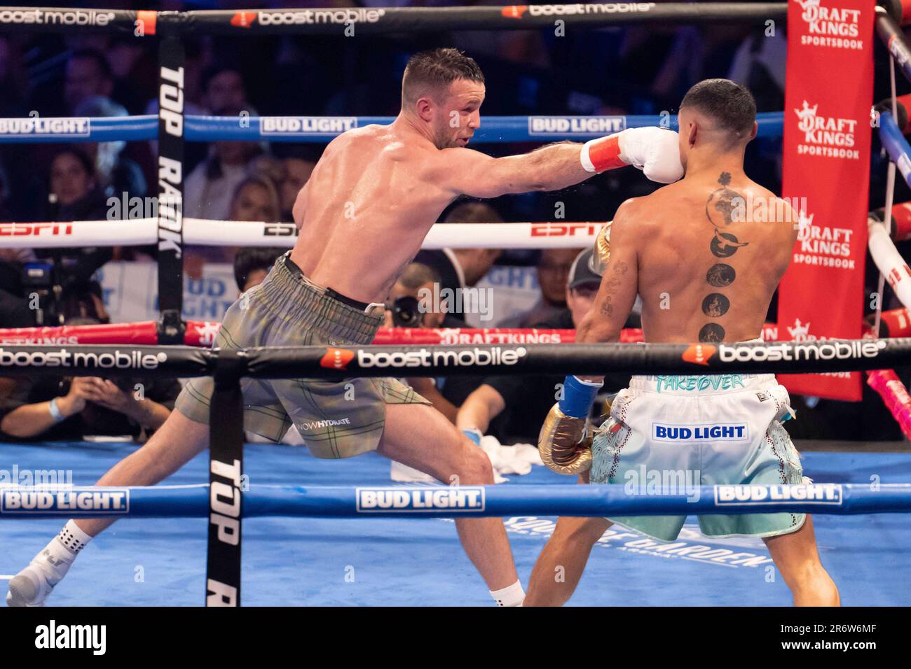 June 10, 2023, New York, New York, USA: TEOFIMO LOPEZ (teal trunks) and JOSH TAYLOR battle in a ...