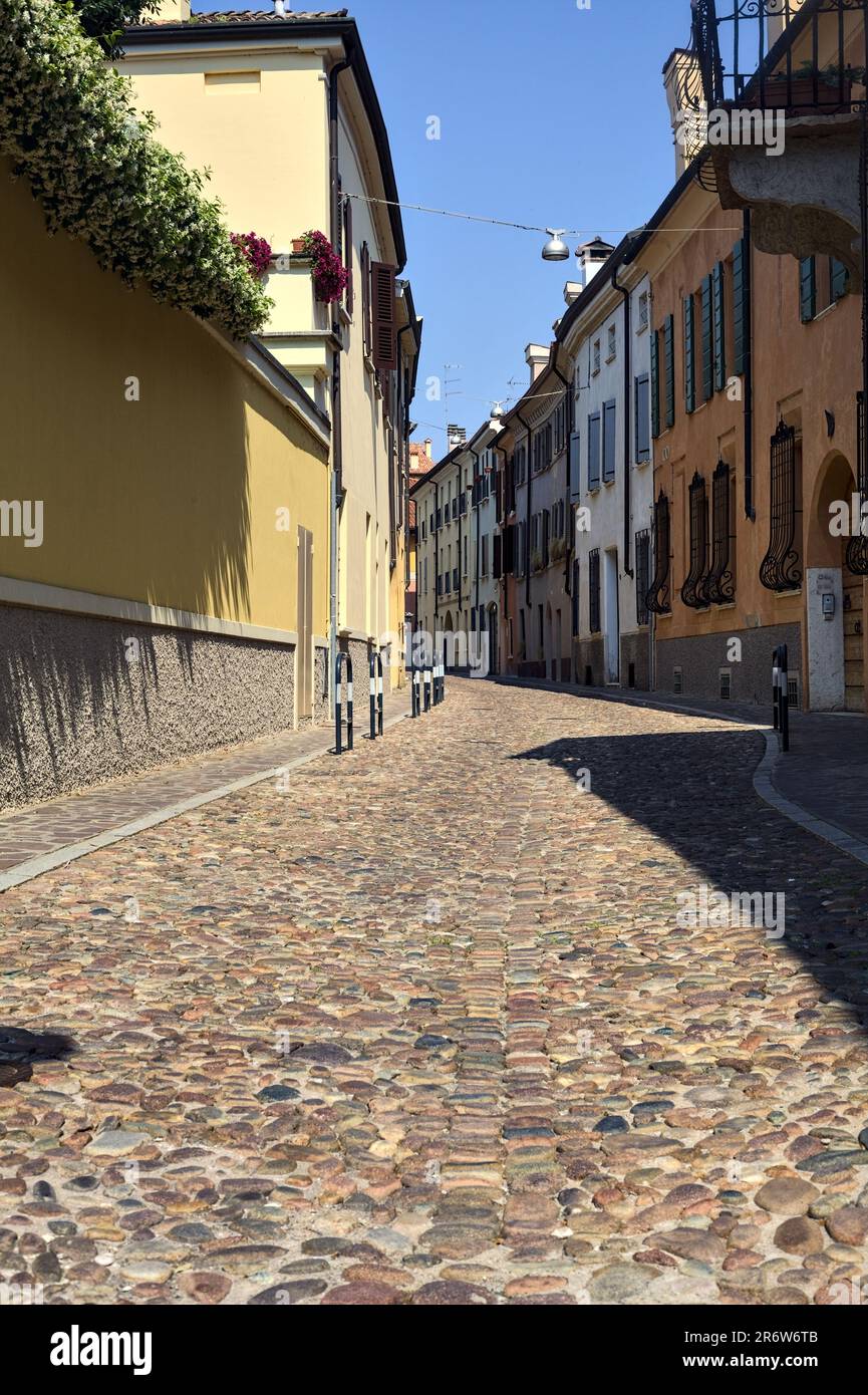 Cobbled and empty street in an italian town on a sunny day Stock Photo ...