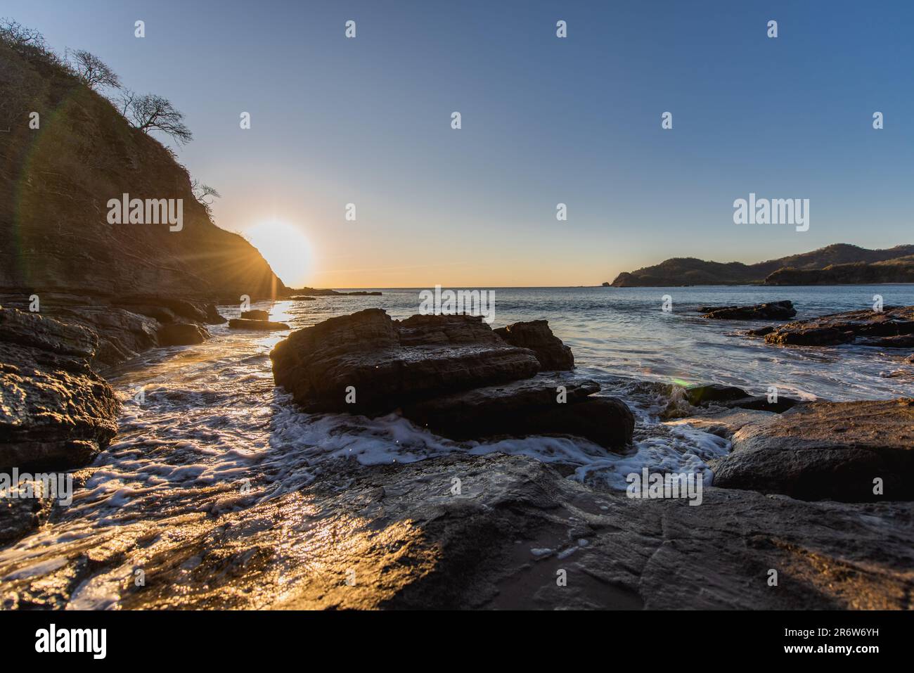 Sunset landscape photo with clear sky overlooking the sandy beach ...