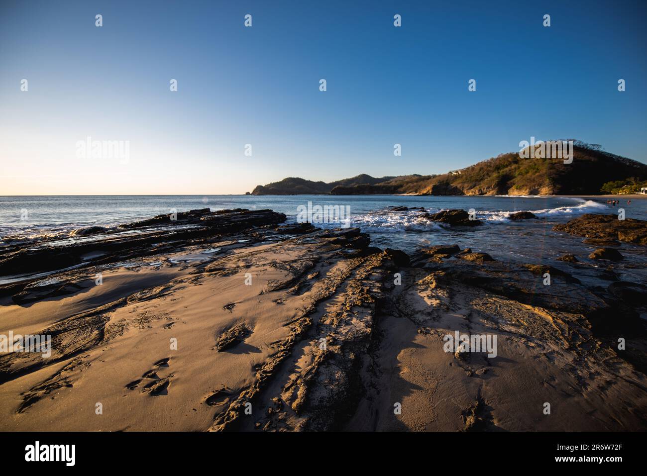 Sunset landscape photo with clear sky overlooking the sandy beach ...