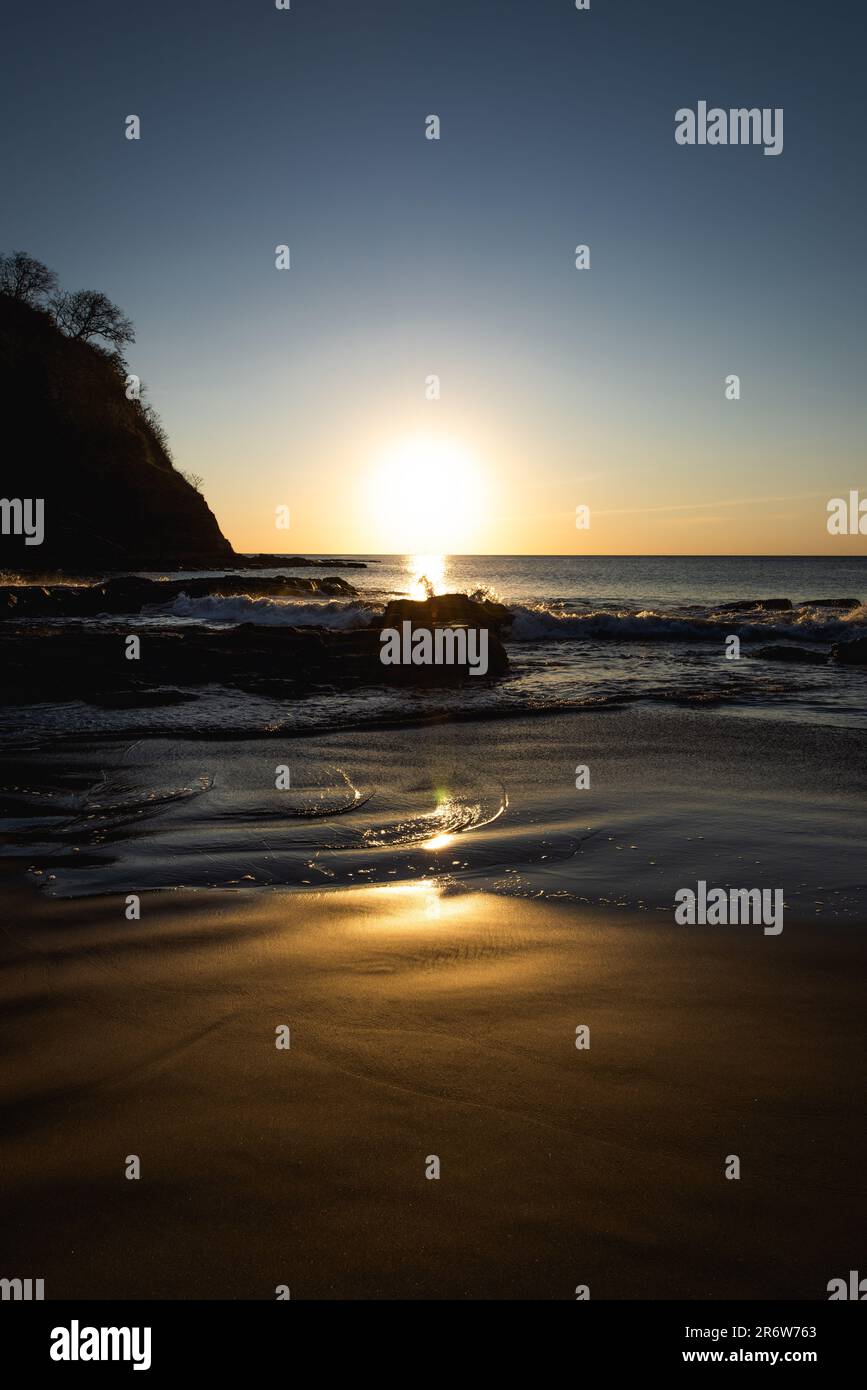 Sunset landscape photo with clear sky overlooking the sandy beach ...