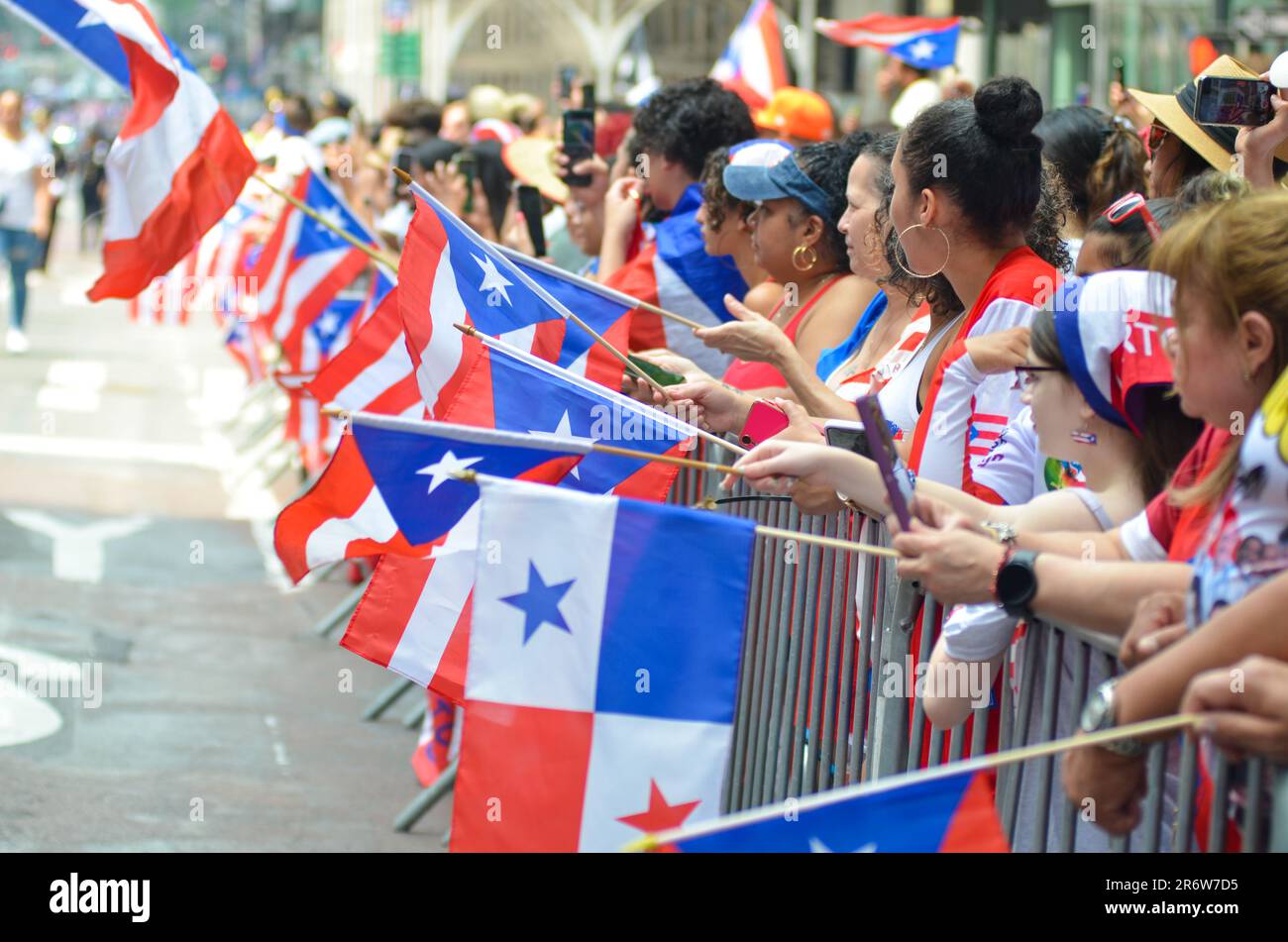 New York City, United States. 11th June, 2023. Spectators with flags ...