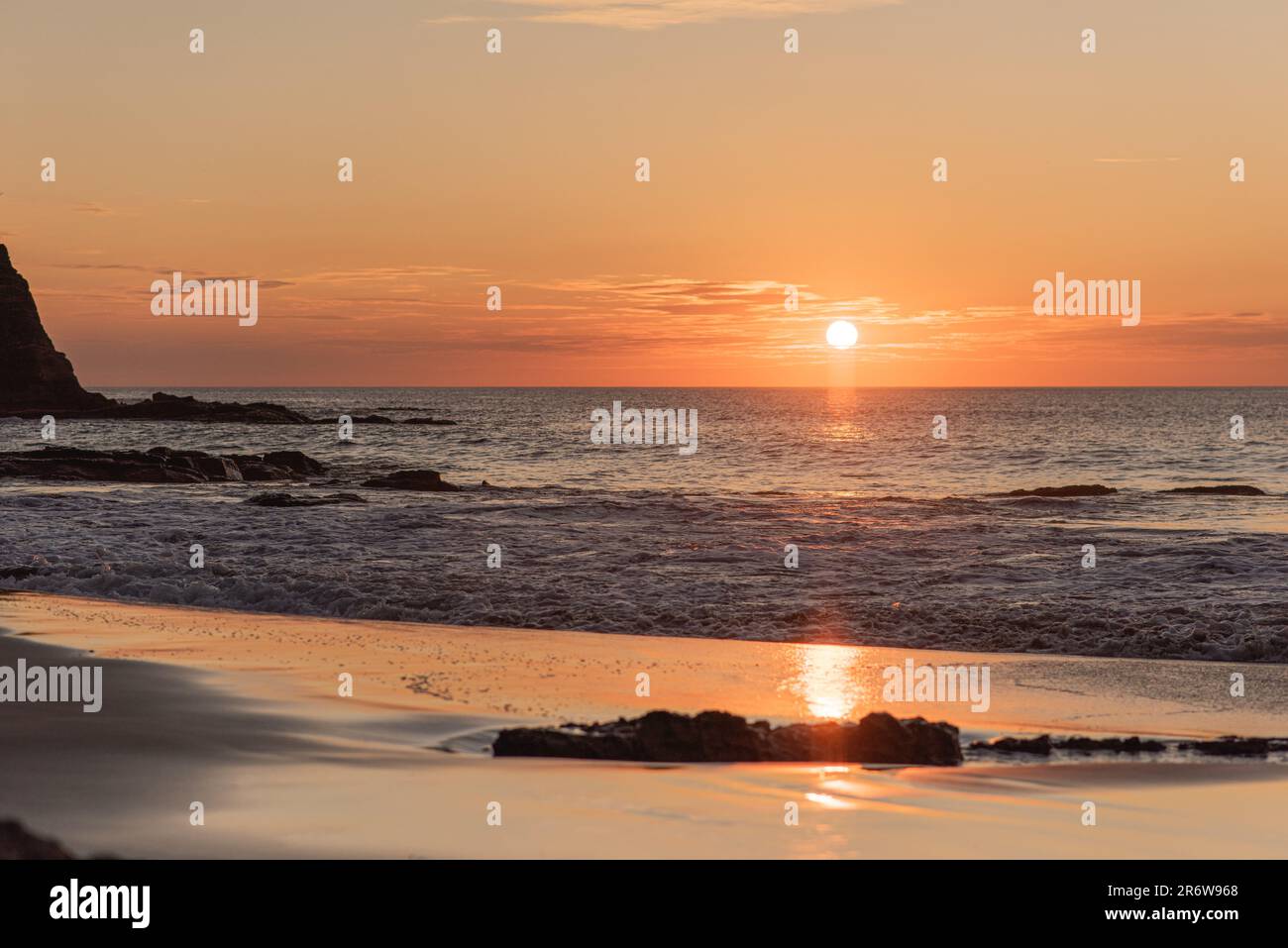 Beautiful orange pacific ocean sunset on the beach near San Juan del ...