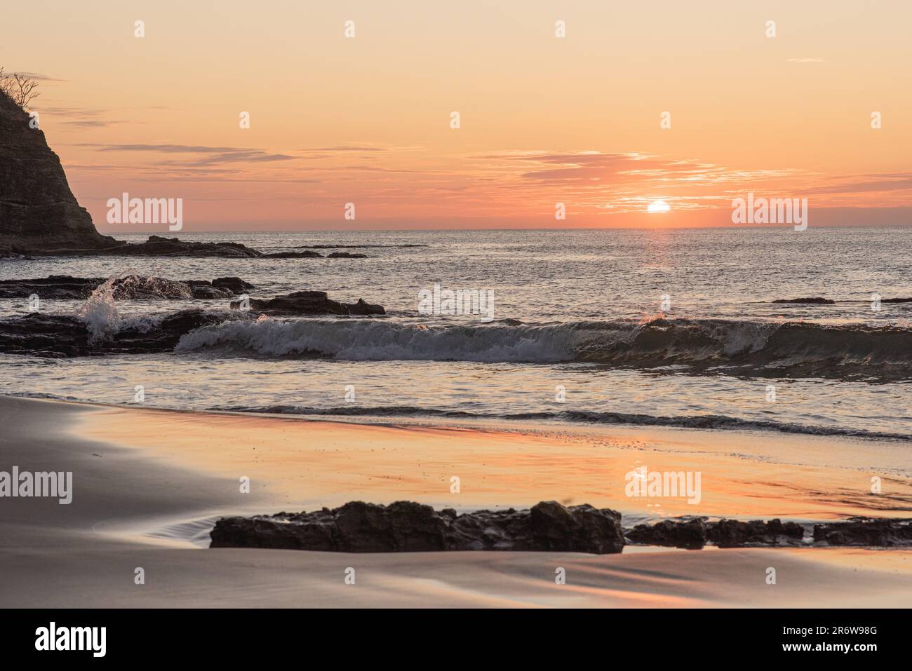 Beautiful orange pacific ocean sunset on the beach near San Juan del ...