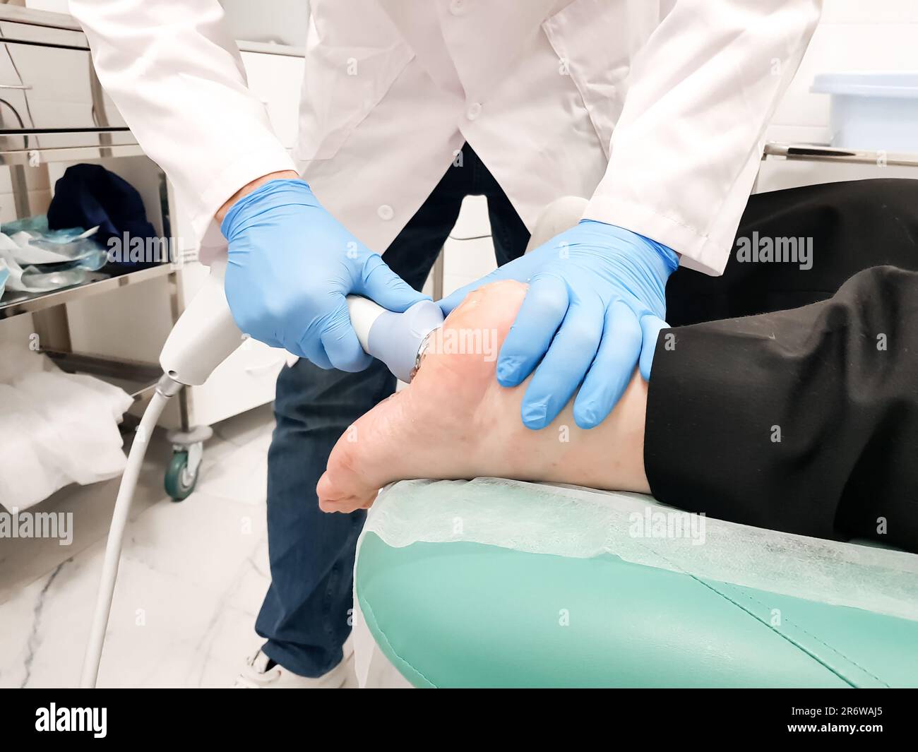 Extracorporeal shock wave therapy ESWT of heel. Visit to office of ...