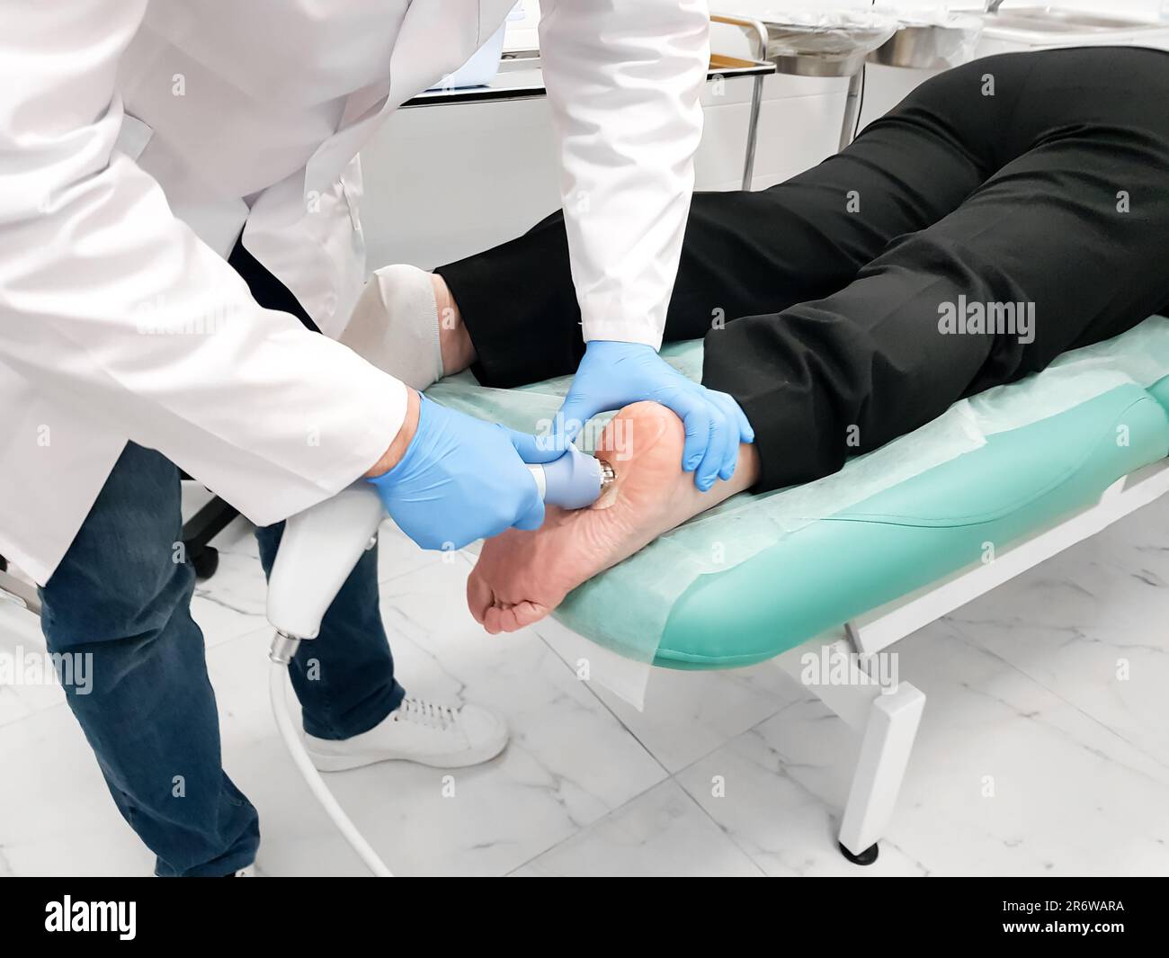 Extracorporeal shock wave therapy ESWT of heel. Visit to office of ...