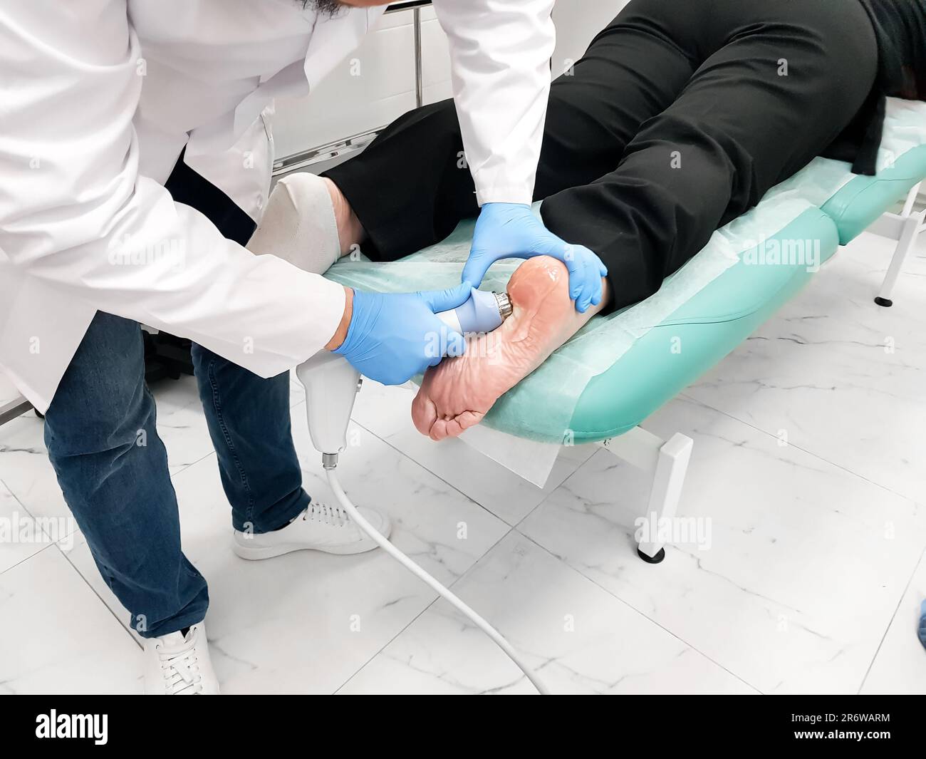 Extracorporeal shock wave therapy ESWT of heel. Visit to office of ...