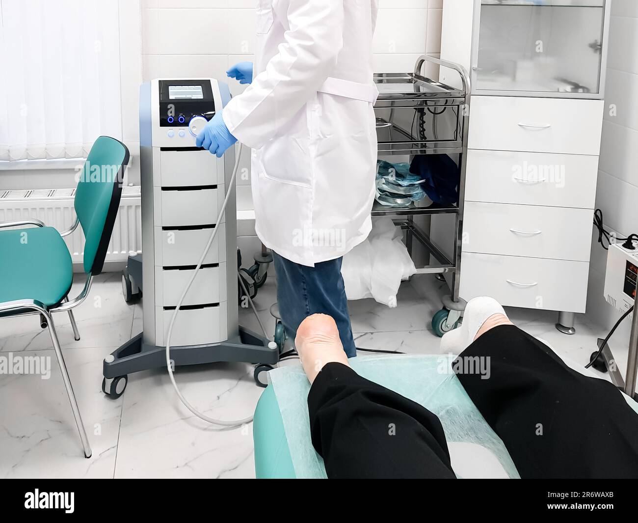 Extracorporeal shock wave therapy ESWT of heel. Visit to office of ...