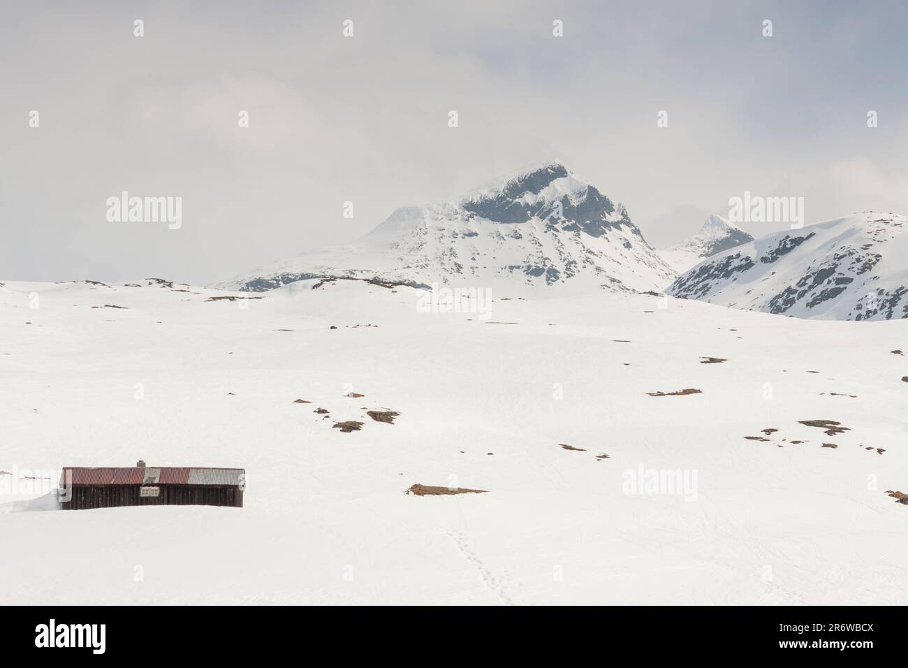 Wooden cottage under snow - Norway. Road 55 to highest pass Stock Photo ...