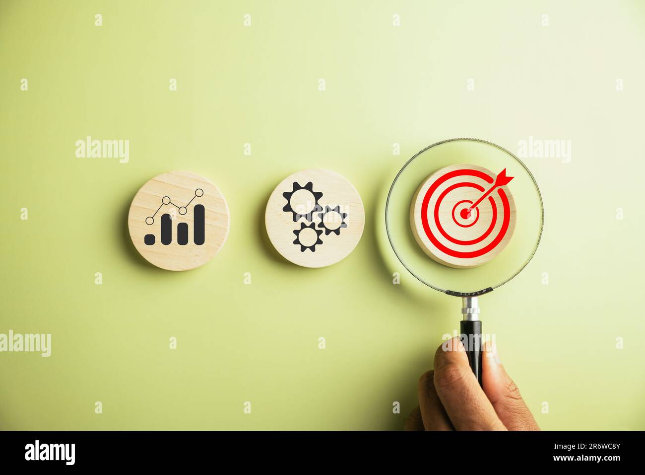 Target icon under magnifying glass Stock Photo - Alamy