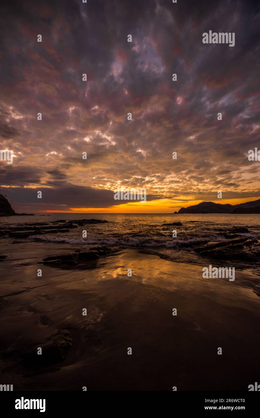 Long exposure landscape photo of pacific ocean water flowing over rocks ...