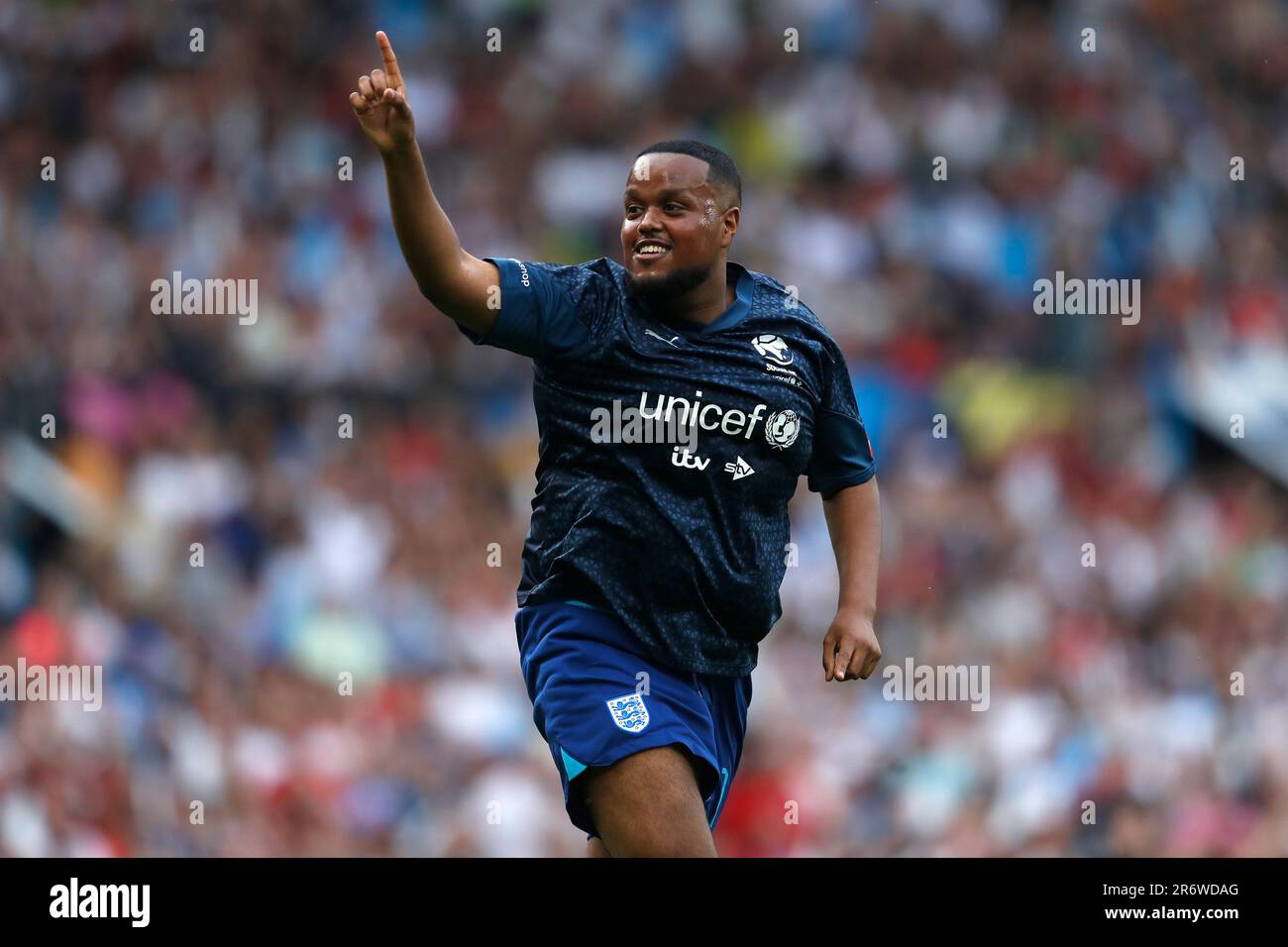 England's Chunkz celebrates scoring a goal in the arm up before Soccer ...