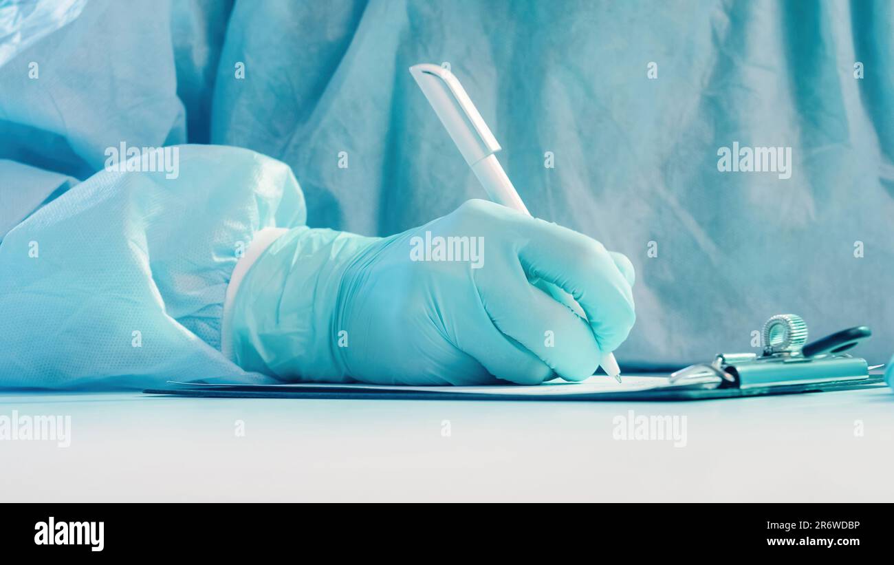 Medical history sick list doctor hand report pen Stock Photo - Alamy