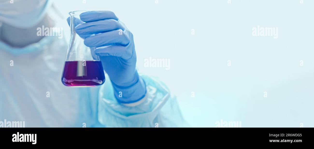 Clinical research laboratory technician hand flask Stock Photo - Alamy