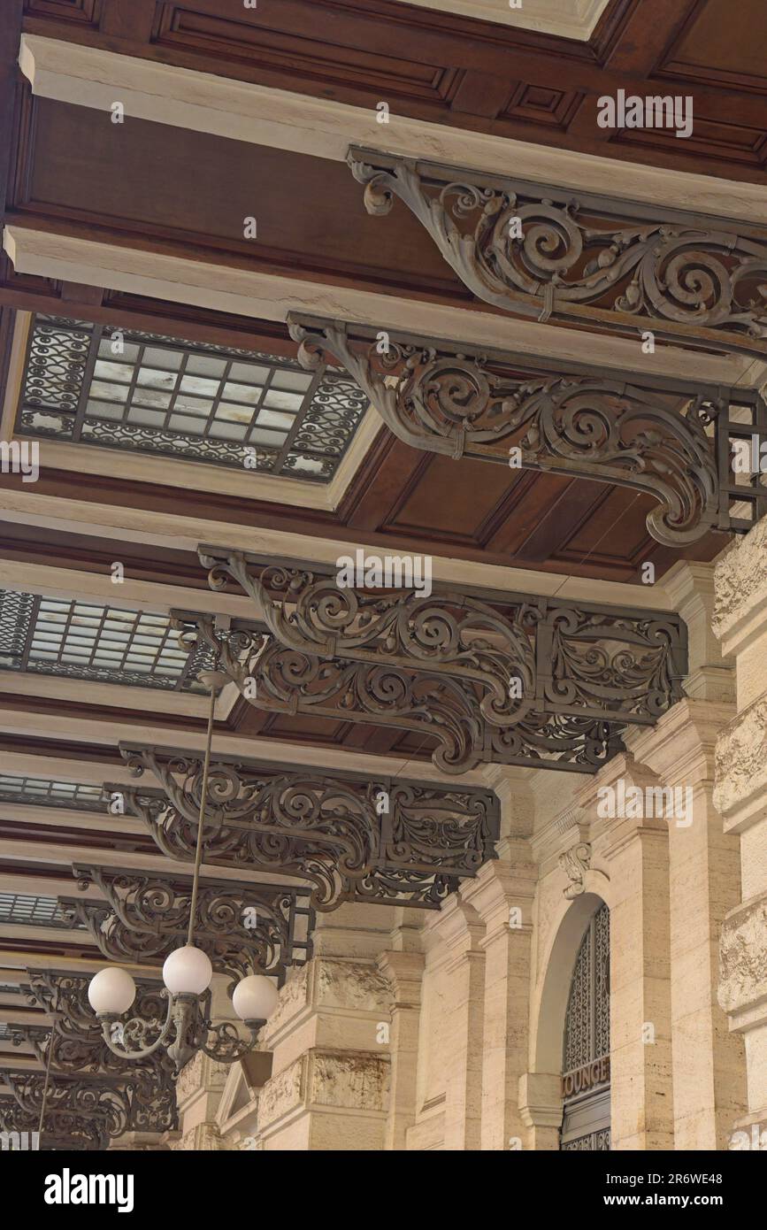 Details or the ornate iron capony supports at the historic Napoli ...