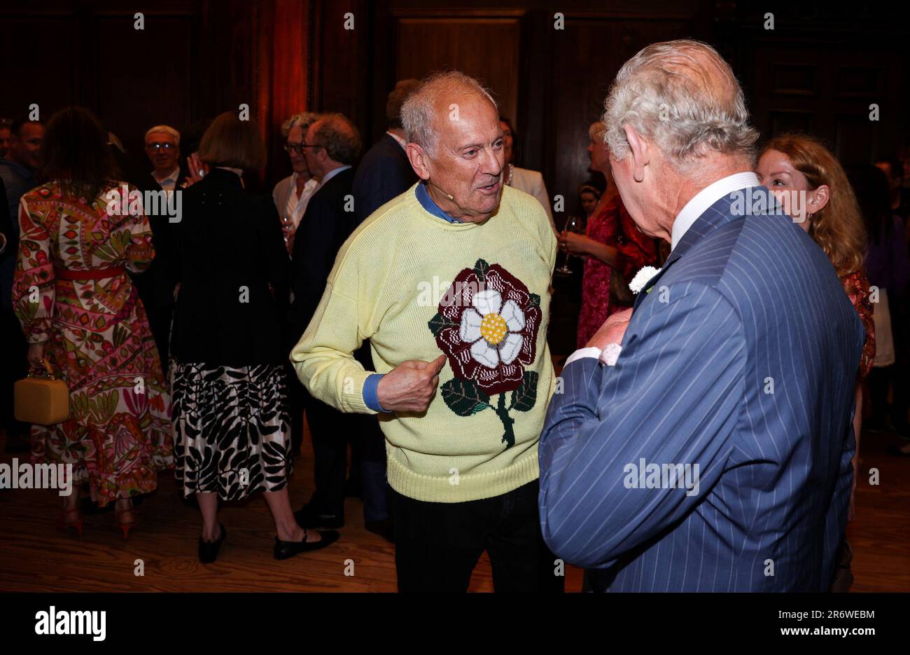 King Charles III talks with author and broadcaster Gyles Brandreth (centre), during a reception ...