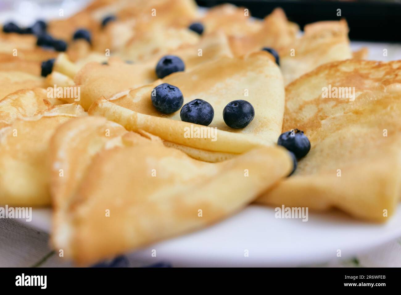home made Ukrainian crepes (blini) decorated with blueberries Stock ...