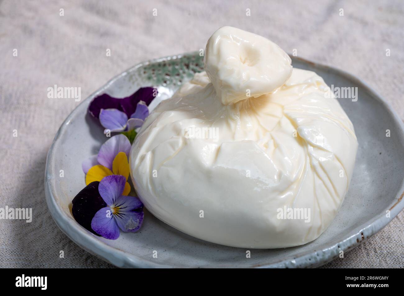 Fresh handmade soft Italian cheese from Puglia, white ball of burrata ...