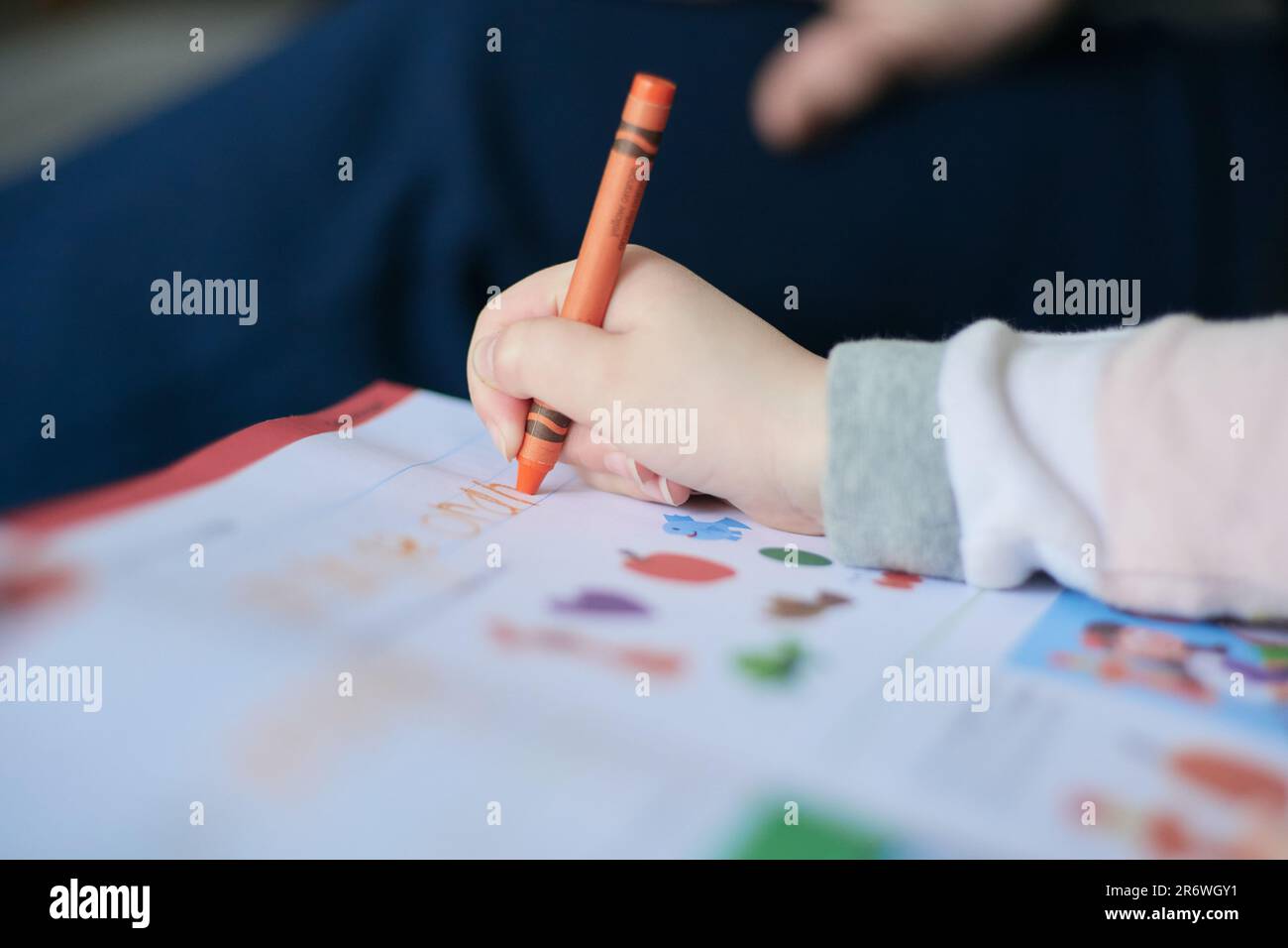 young girl practicing her writing skills Stock Photo - Alamy
