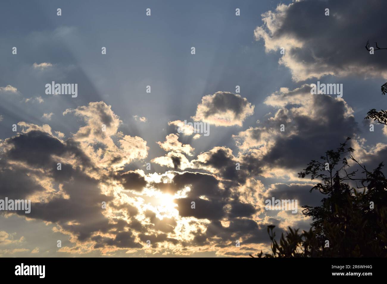 sun is hidden behind clouds Stock Photo - Alamy