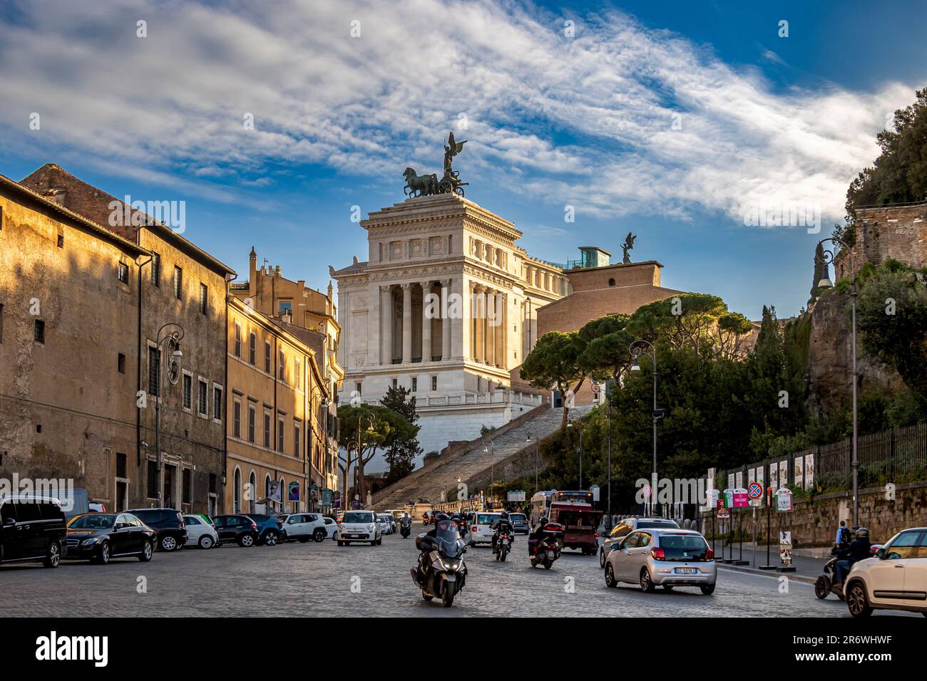Vehicles driving down Via del Teatro di Marcello, with the Victor ...