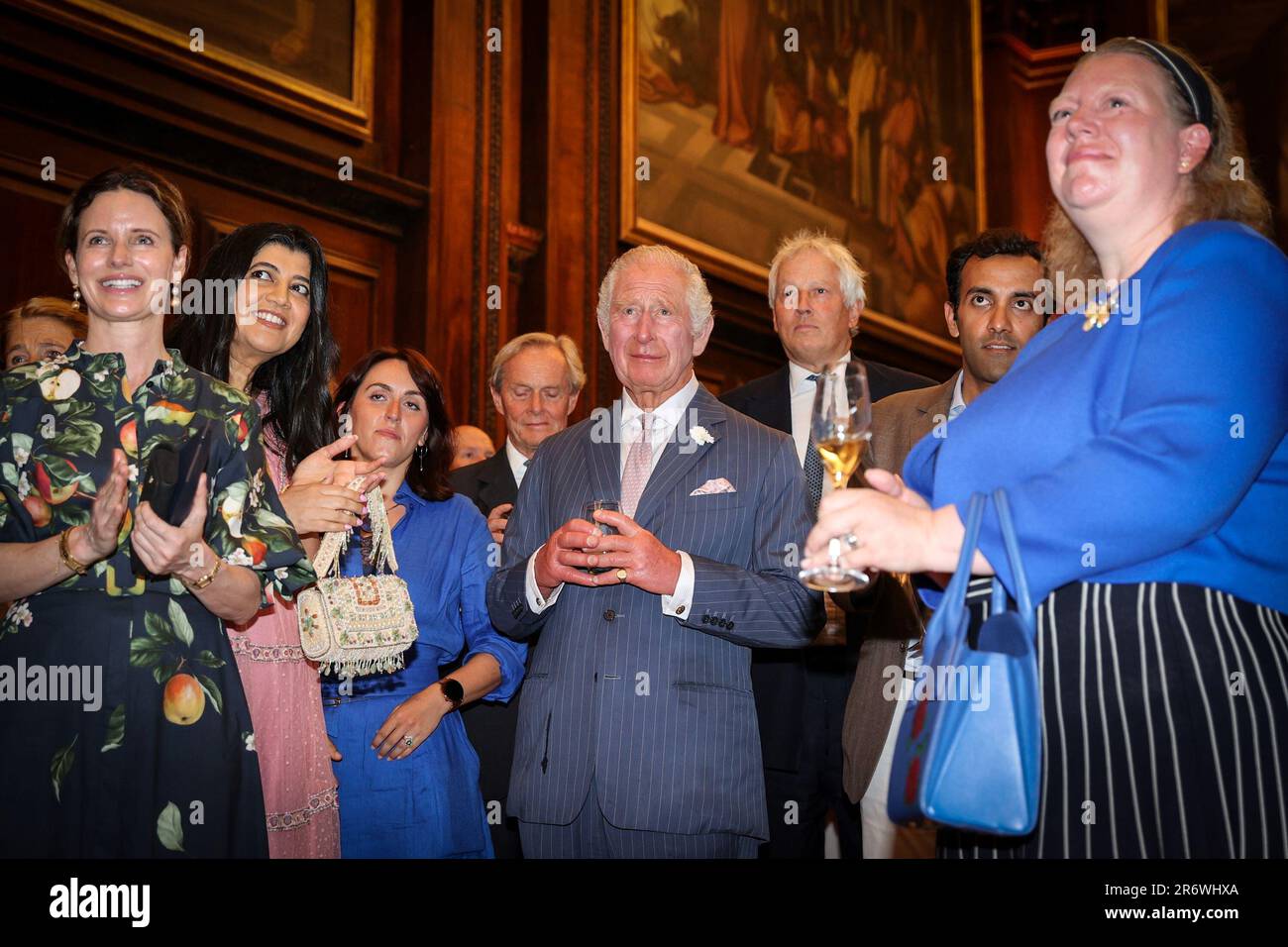 King Charles III (centre) listens to readings by actress Joanna Lumley and actor Richard E ...