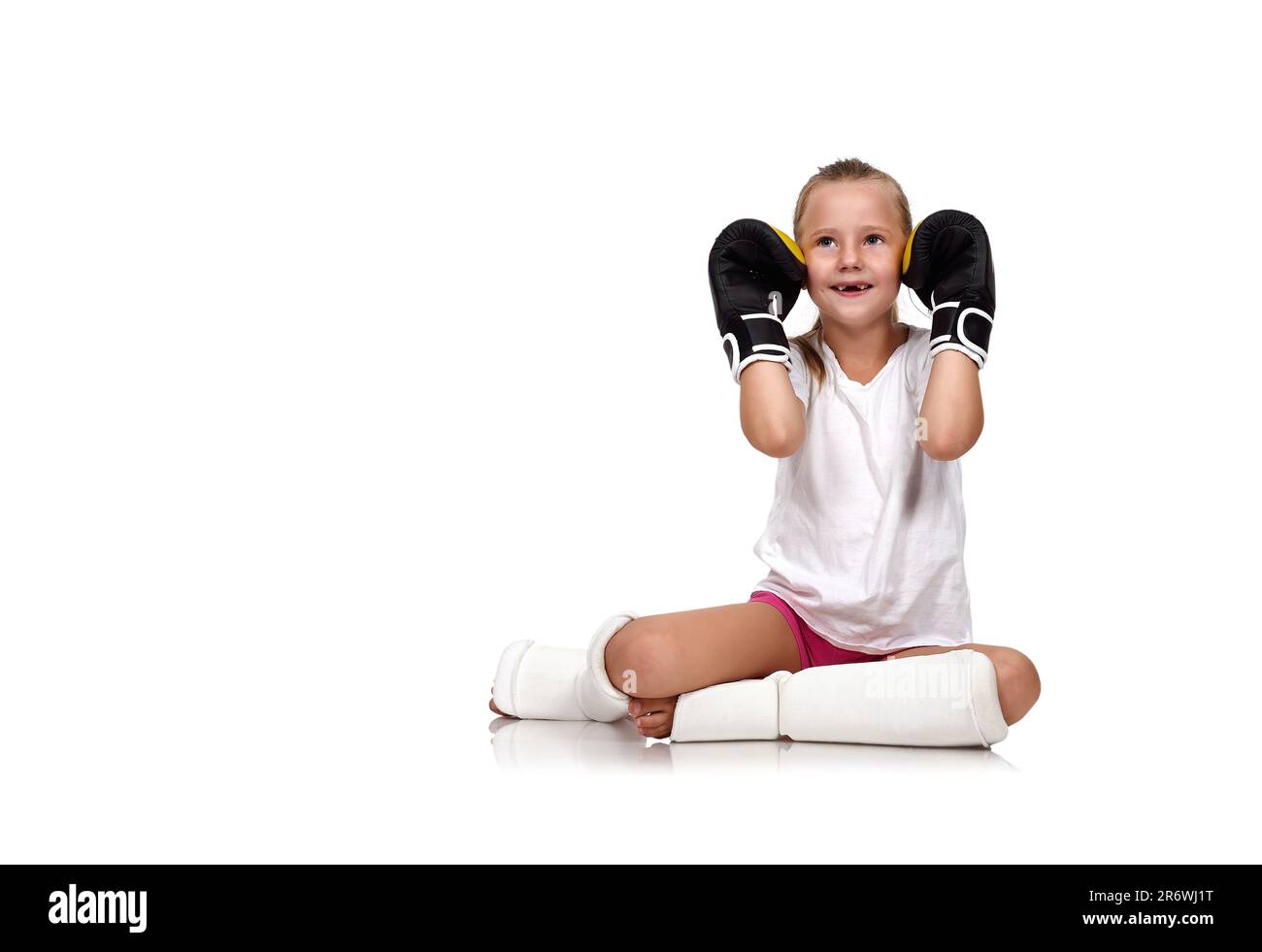 happy thai boxing girl sitting on floor Stock Photo - Alamy
