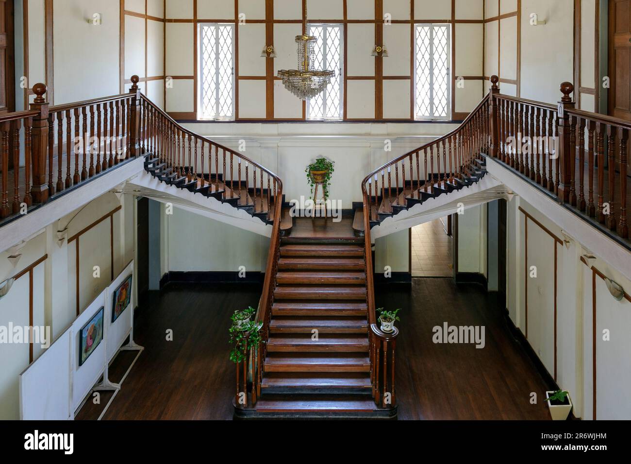 Lobby with a chandelier and a grand staircase at the Candacraig Hotel ...