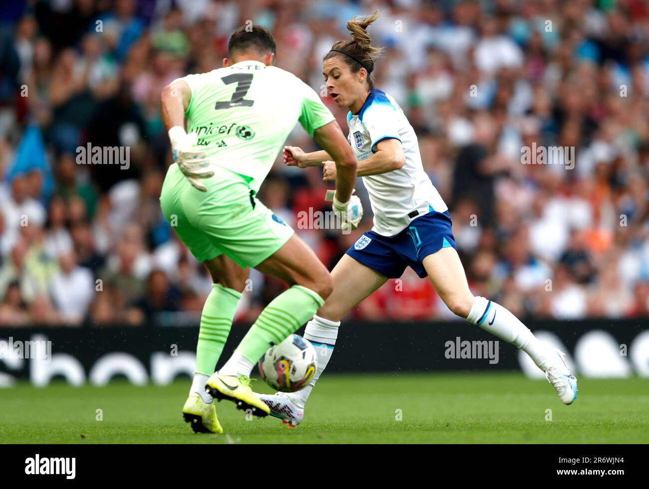 England's Karen Carney (right) attempts to get past Soccer Aid World XI ...