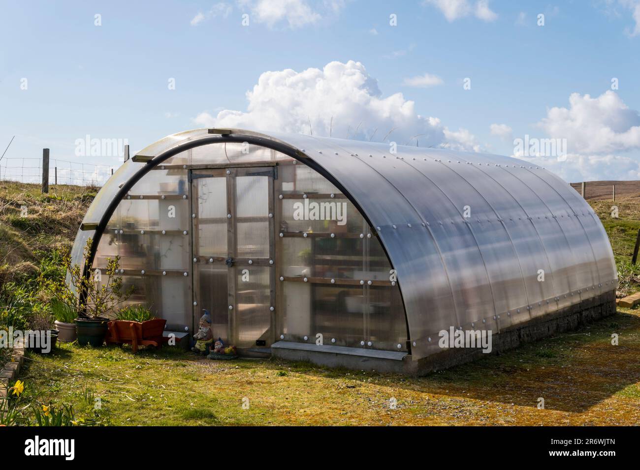 A sturdy greenhouse built to withstand the weather conditions on ...