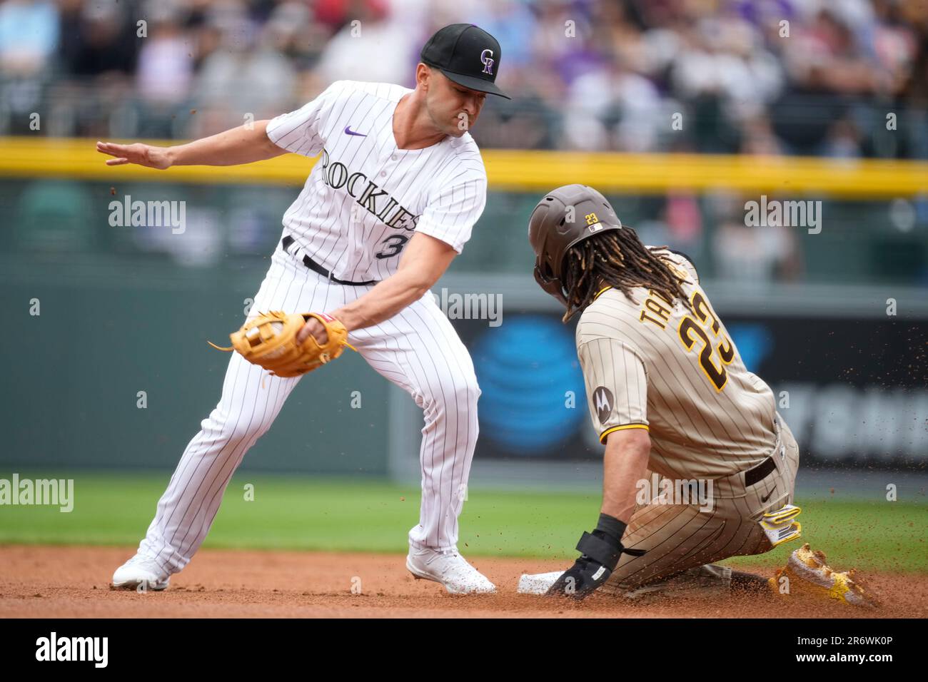Colorado Rockies second baseman Coco Montes, left, fields a throw as ...