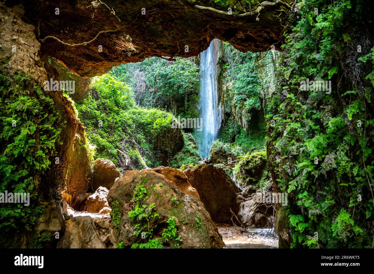 Waterfall of Nemouta in Peloponnese in Greece in a green gorge and cave ...