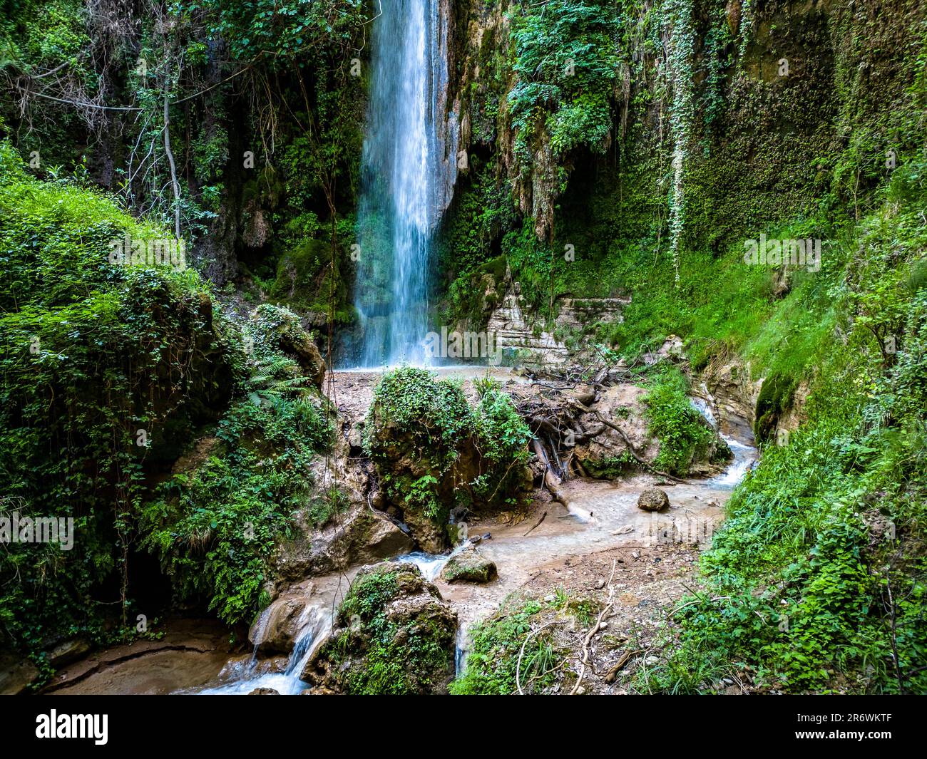 Waterfall of Nemouta in Peloponnese in Greece in a green gorge and cave ...