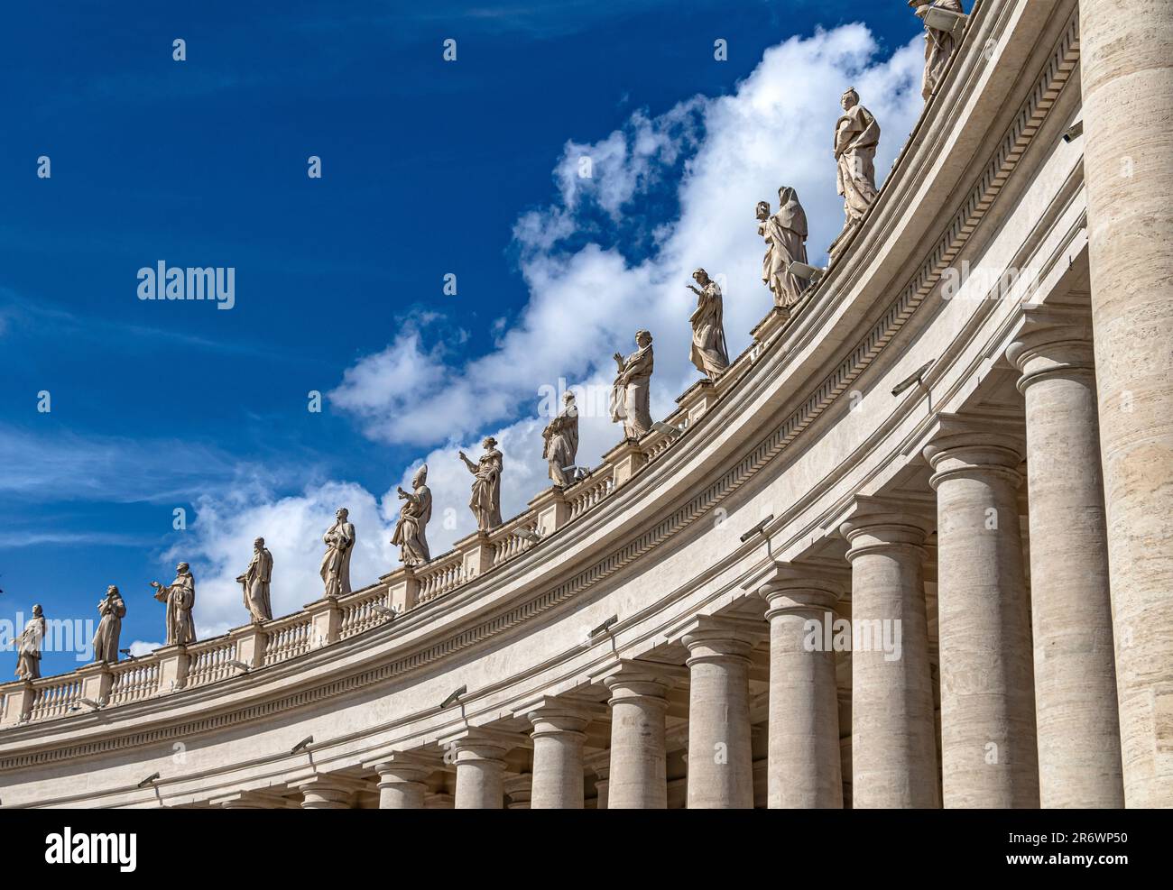 Close up of the The Doric colonnades with statues of Saints watching over the Square, St. Peter ...