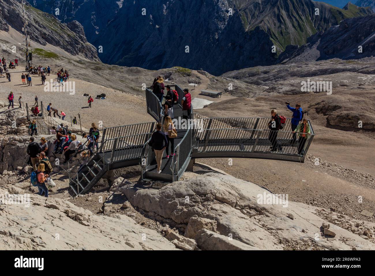 ZUGSPITZE, GERMANY - SEPTEMBER 4, 2019: Tourists enjoy a viewpoint at ...